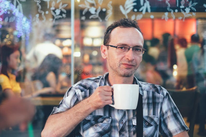 Handsome Man in a Cafe Outside Drinking Coffee Stock Photo - Image of ...
