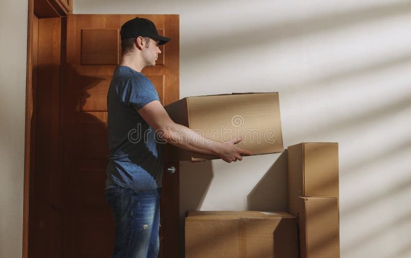 Handsome Man Delivers Cardboard Boxes Stock Image - Image of carton ...