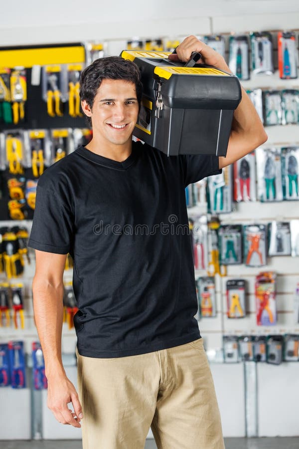 Handsome Man Carrying Toolbox on Shoulder in Store Stock Image - Image ...