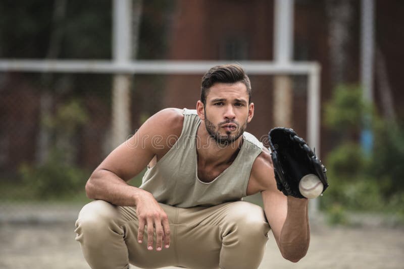 Handsome Baseball Player Ready To Catch Ball on Court Stock Photo ...