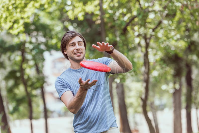 Handsome Man Catching Frisbee Disk Stock Photo - Image of male, people ...