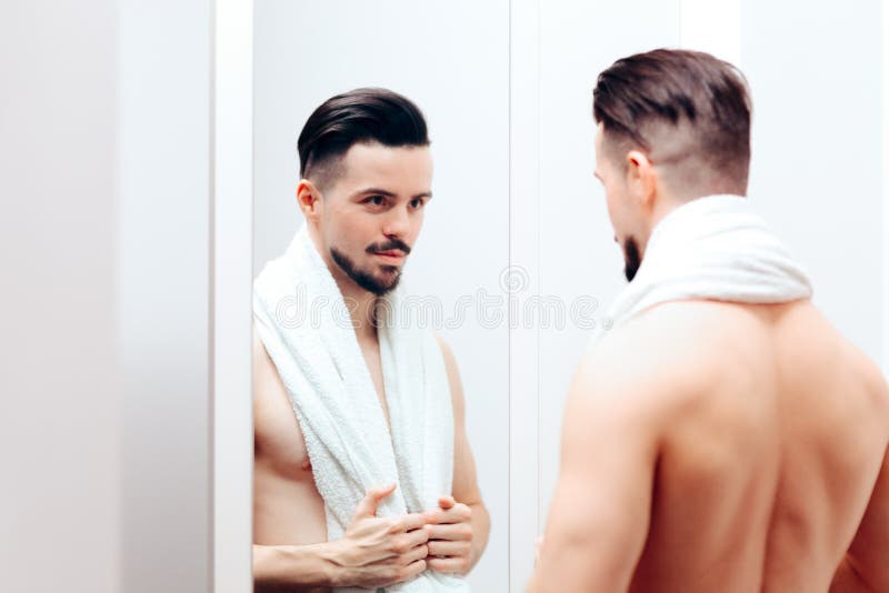 Handsome Man Checking Himself in the Mirror Stock Photo - Image of ...