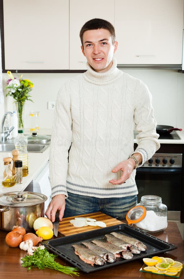 Handsome Man Cooking Fish in Baking Sheet Stock Image - Image of ...