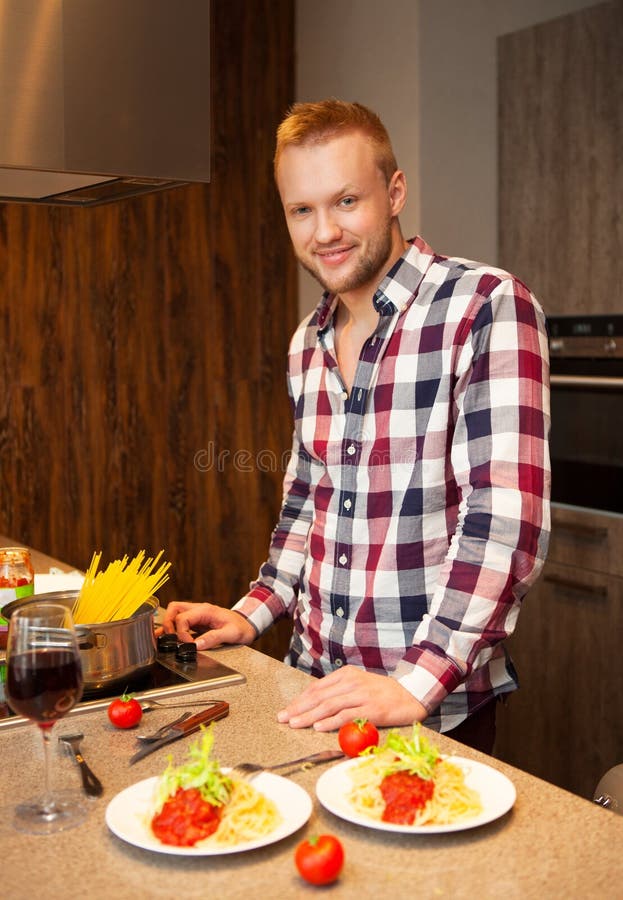 Handsome Man Cooking at Home Preparing Pasta Stock Image - Image of ...