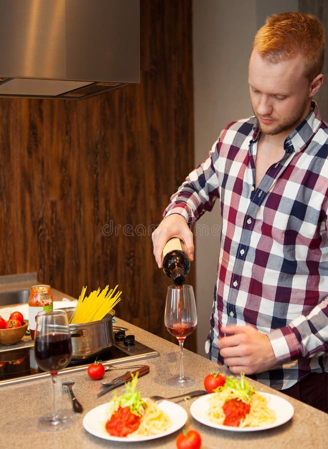 Handsome Man Cooking at Home Preparing Pasta Stock Photo - Image of ...