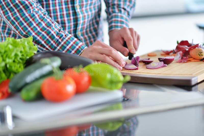 Handsome Man Cooking at Home Preparing Salad in Kitchen. Stock Image ...