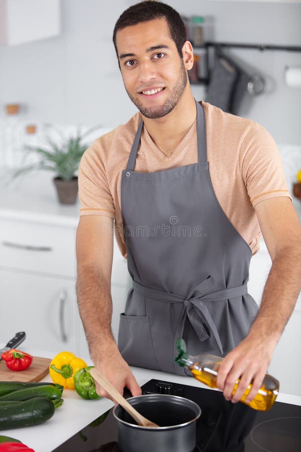 Handsome Man Cooking on Kitchen and Smiling Stock Photo - Image of ...