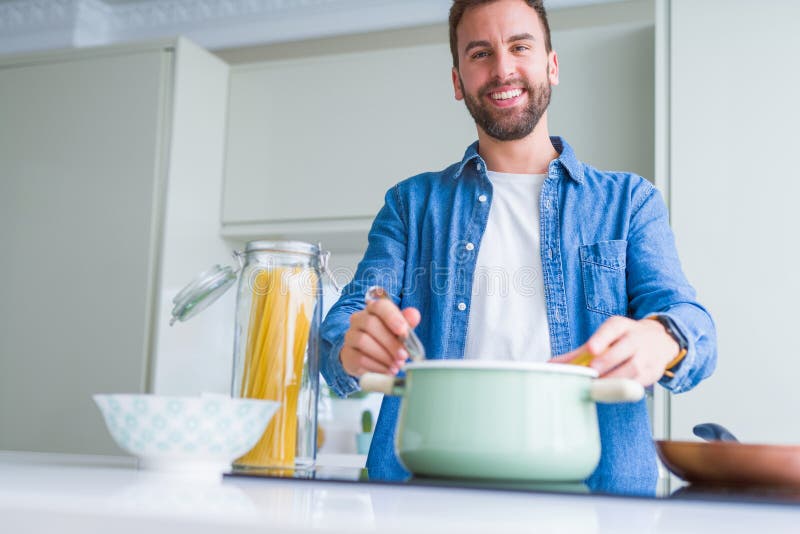 Handsome Man Cooking Pasta at Home Stock Image - Image of italian, meal ...