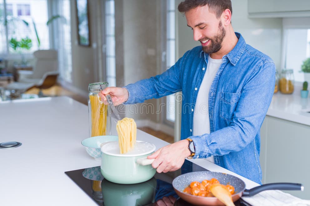 Handsome Man Cooking Pasta at Home Stock Image - Image of cool ...