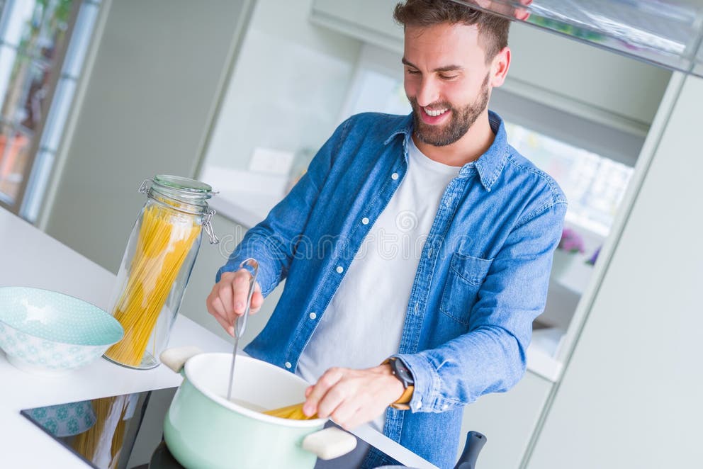 Handsome Man Cooking Pasta at Home Stock Image - Image of eating ...