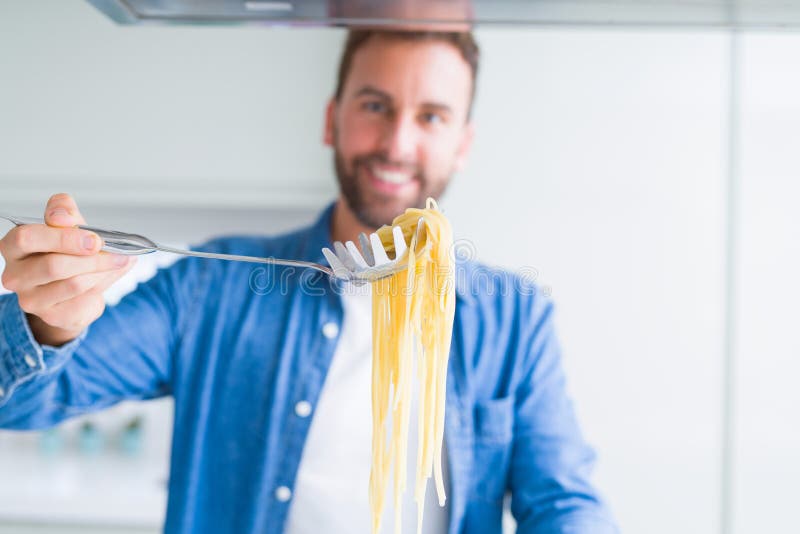 Handsome Man Cooking Pasta at Home Stock Photo - Image of cooking, cook ...