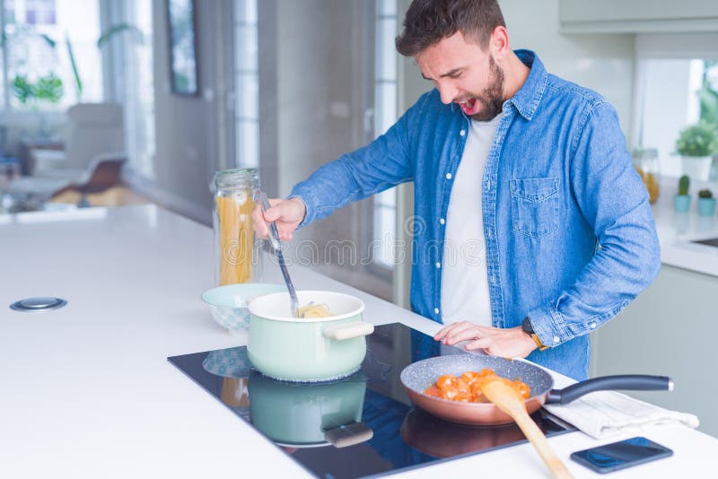 Handsome Man Cooking Pasta at Home Stock Image - Image of meal ...