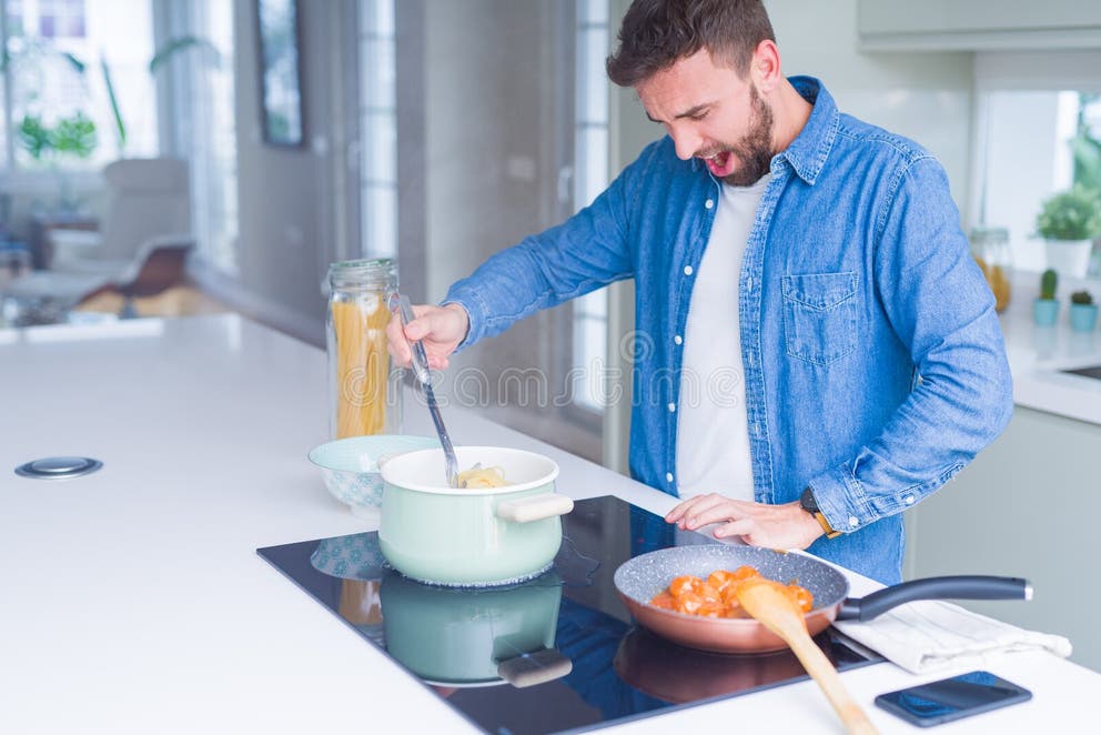 Handsome Man Cooking Pasta at Home Stock Image - Image of meal ...