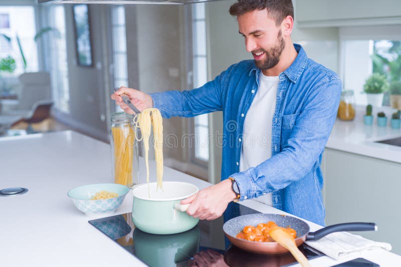 Handsome Man Cooking Pasta at Home Stock Image - Image of male, kitchen ...