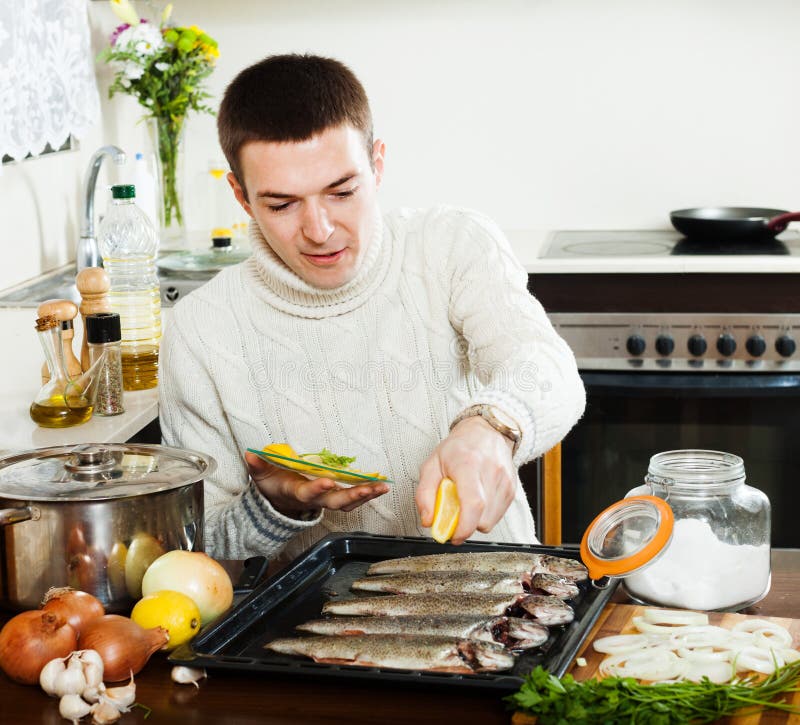 Handsome Man Cooking Trout Fish with Lemon Stock Photo - Image of fresh ...