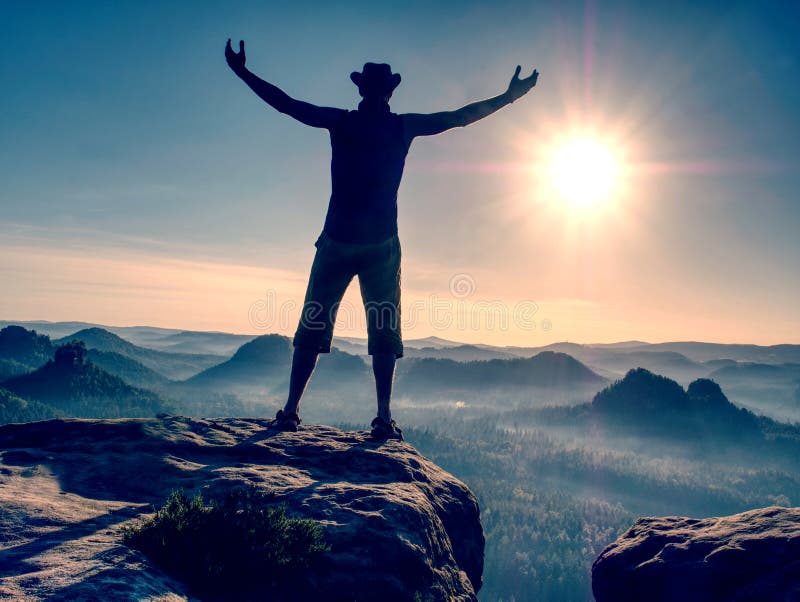 Handsome Man in Cowboy Clothes at the Edge. Man Above Stock Image ...