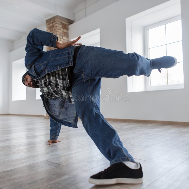 Handsome Man Dancer Dancing. Man Stands on Hands in a Dance Stock Photo ...
