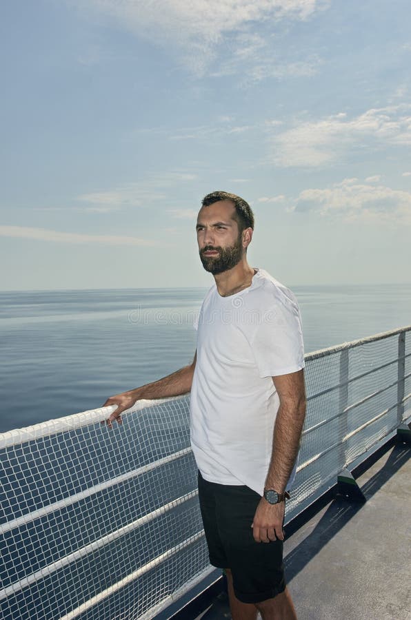 Handsome Man on the Deck of a Ship during Holiday. Stock Photo - Image ...