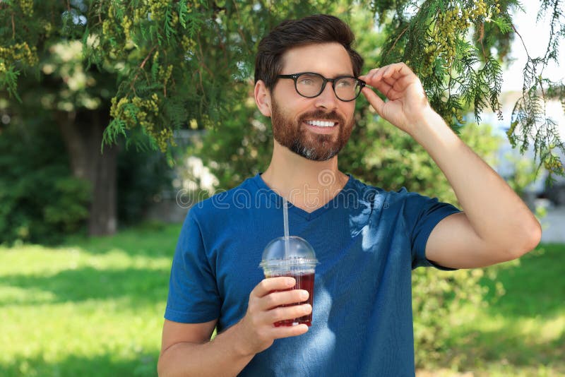 Handsome Man with Delicious Juice in Park Stock Photo - Image of ...