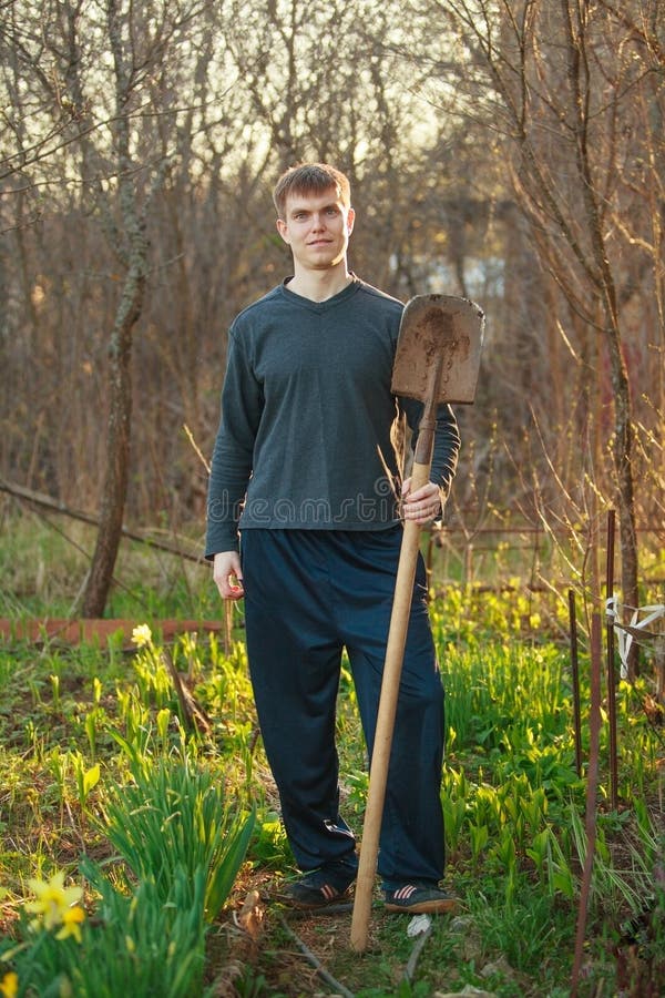 Handsome man digging stock photo. Image of agriculture - 70886450