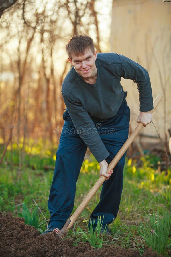 Handsome man digging stock image. Image of people, residential - 168023221