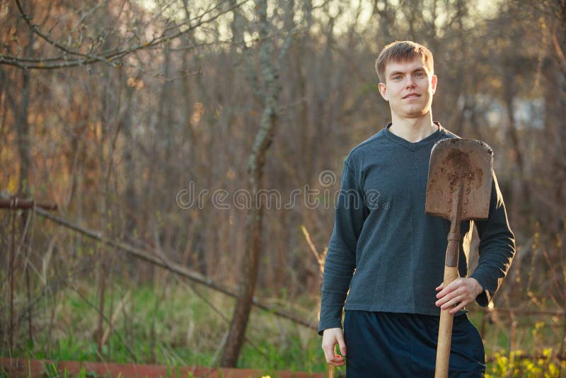 Handsome man digging stock photo. Image of agriculture - 70886450