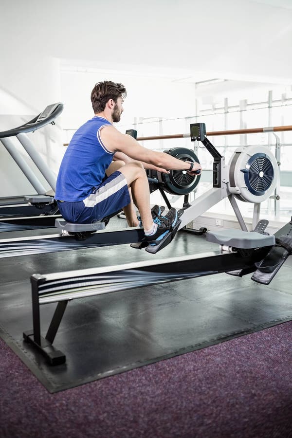 Handsome Man Doing Exercise on Drawing Machine Stock Photo - Image of ...