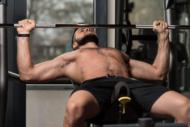 Handsome Man Doing Heavy Weight Exercise for Chest Stock Photo - Image ...