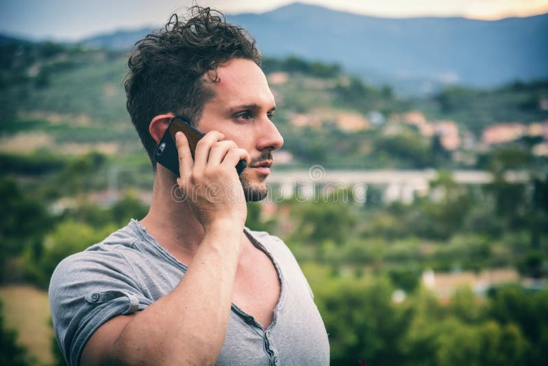 Handsome Man Doing a Phone Call Stock Photo - Image of cell, standing ...