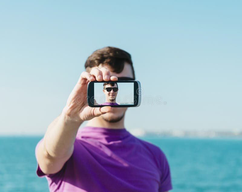 Handsome Man Doing a Self-portrait with Smartphone Stock Image - Image ...