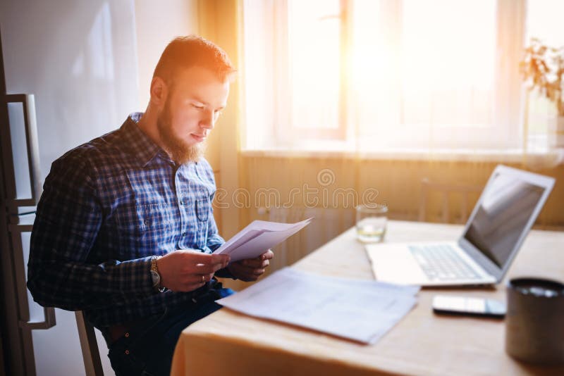 Handsome Man Doing Some Paperwork at Home Stock Photo - Image of home ...