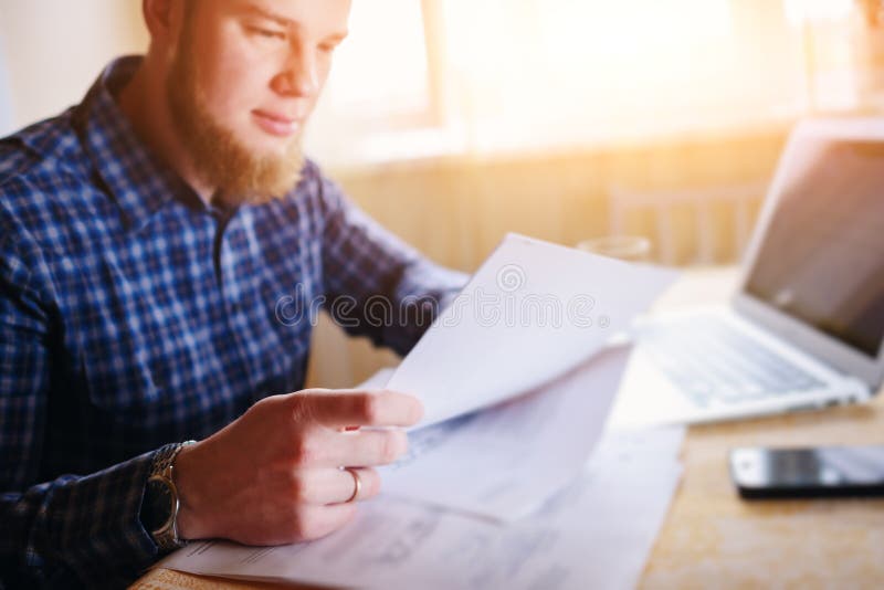Handsome Man Doing Some Paperwork at Home Stock Image - Image of ...