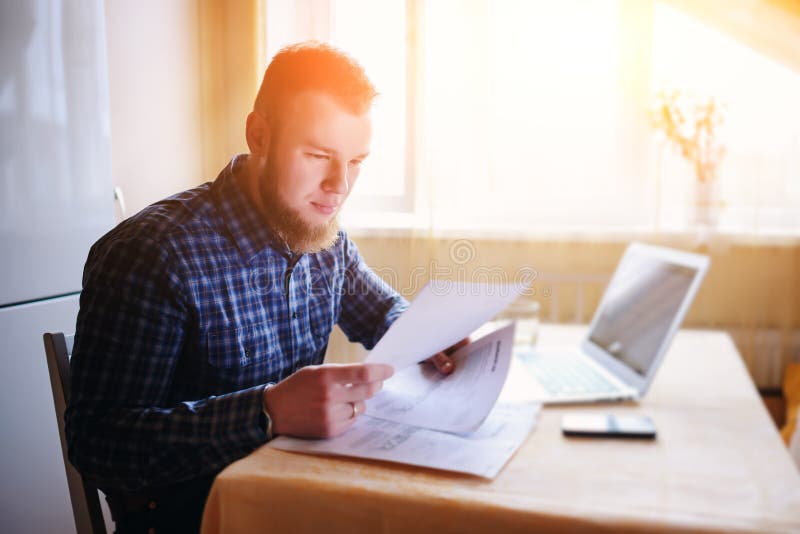 Handsome Man Doing Some Paperwork at Home Stock Image - Image of ...