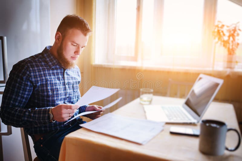 Handsome Man Doing Some Paperwork at Home Stock Photo - Image of ...