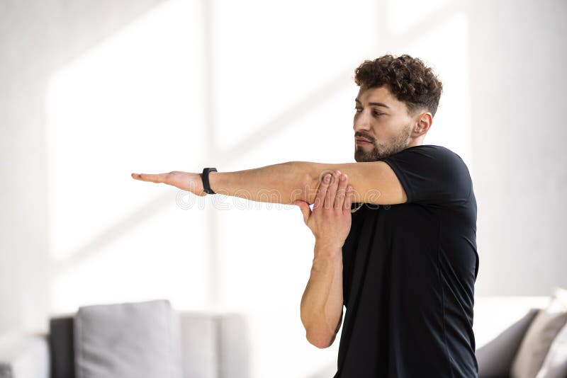 Handsome Man Doing Stretching Exercise at Home Stock Photo - Image of ...