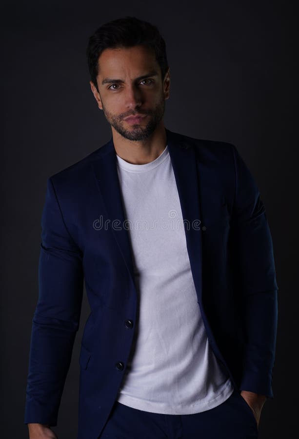 Handsome Man Donning a Sleek Navy Blue Suit on Gray Background Stock ...