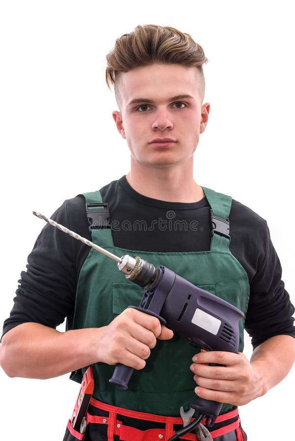 Handsome Man with Drill Machine Posing Isolated on White. Worker in ...