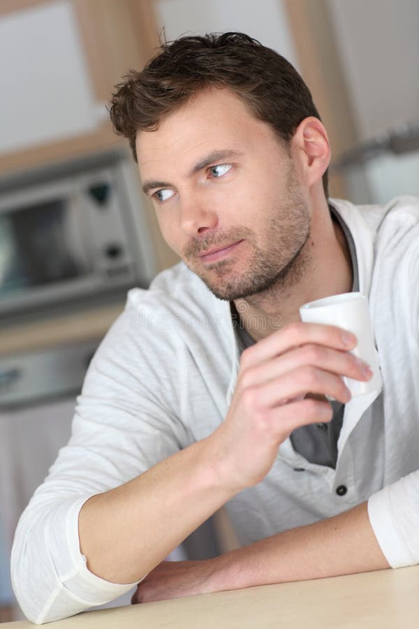 Handsome Man Drinking Coffee at Home Stock Image - Image of domestic ...