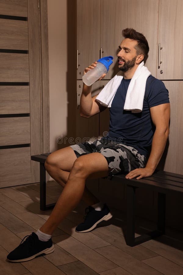 Handsome Man Drinking Water in Locker Room Stock Image - Image of room ...
