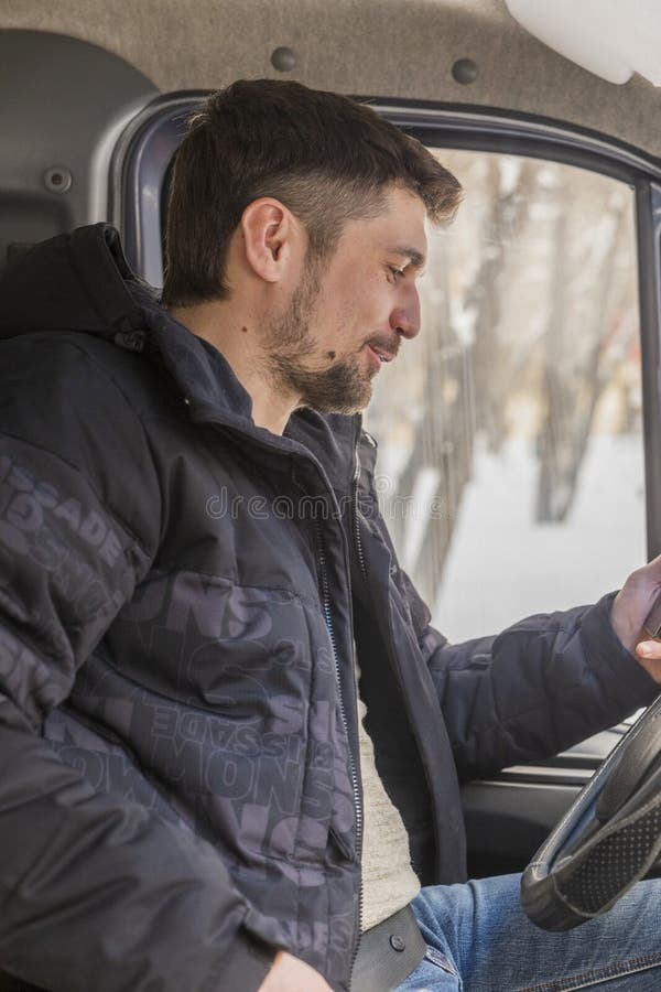 Handsome Man Driving in the Cab of a Large Truck Stock Image - Image of ...