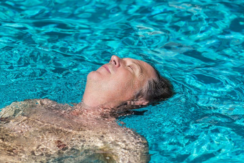 Handsome Man Enjoys Swimming in the Pool Stock Photo - Image of ...