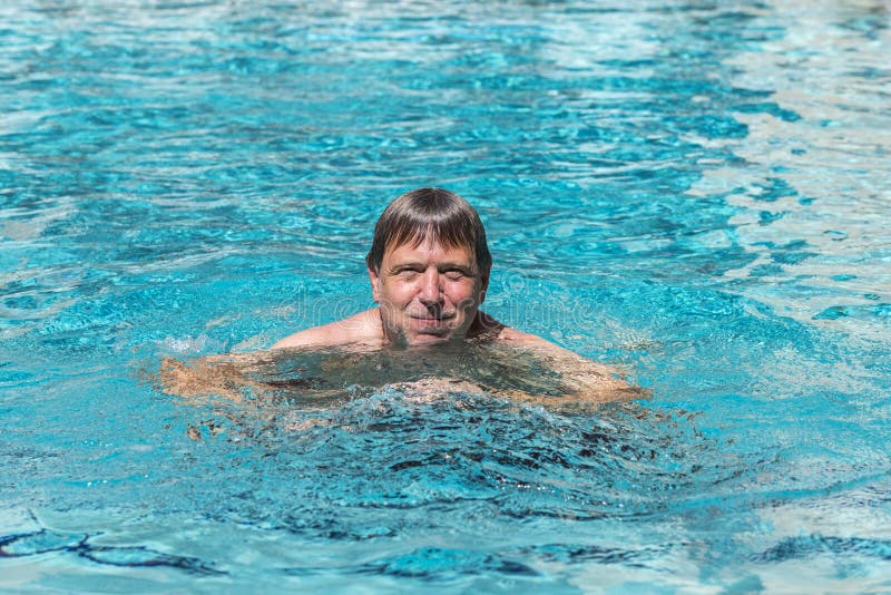 Handsome Man Enjoys Swimming in the Pool Stock Photo - Image of ...
