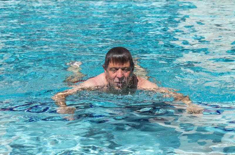 Handsome Man Enjoys Swimming in the Pool Stock Image - Image of ...
