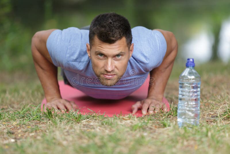 Handsome Man Exercising in Park Stock Photo - Image of exercising ...