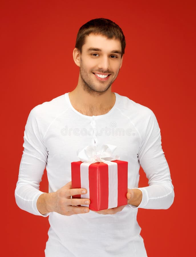 Handsome man with a gift stock photo. Image of ribbon - 39373316