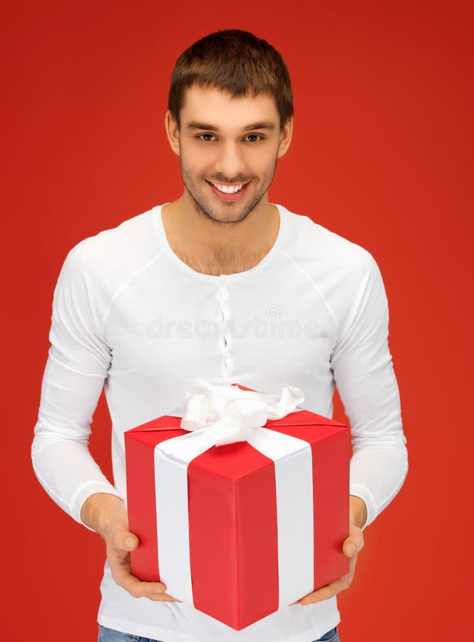 Handsome man with a gift stock photo. Image of merry - 39375428