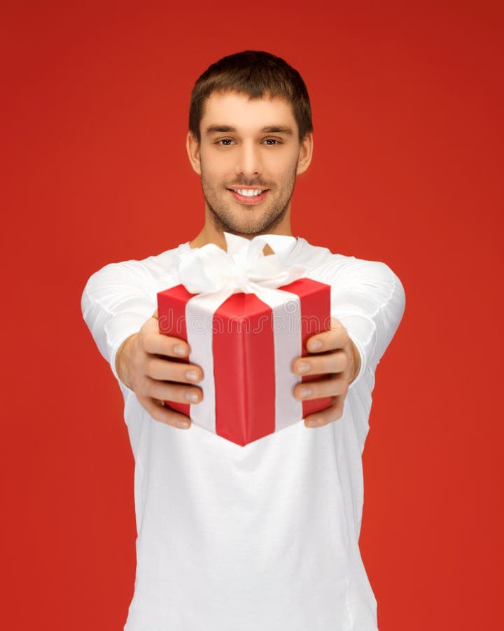Handsome man with a gift stock photo. Image of male, package - 39401586