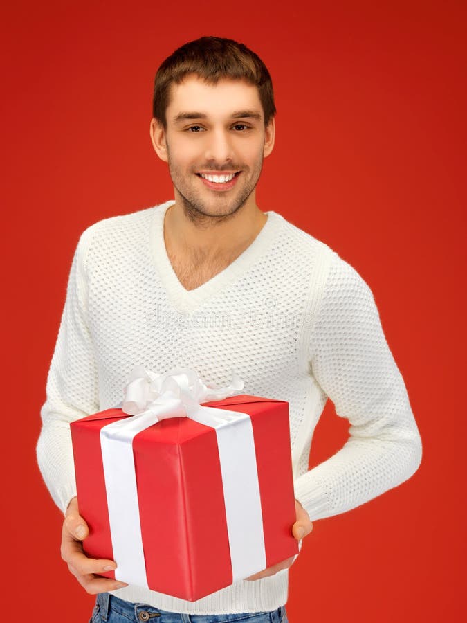 Handsome man with a gift stock photo. Image of looking - 39410712