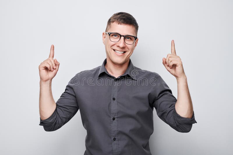 Handsome Man in Glasses Pointing Up Finger, Demonstrating Empty Space ...