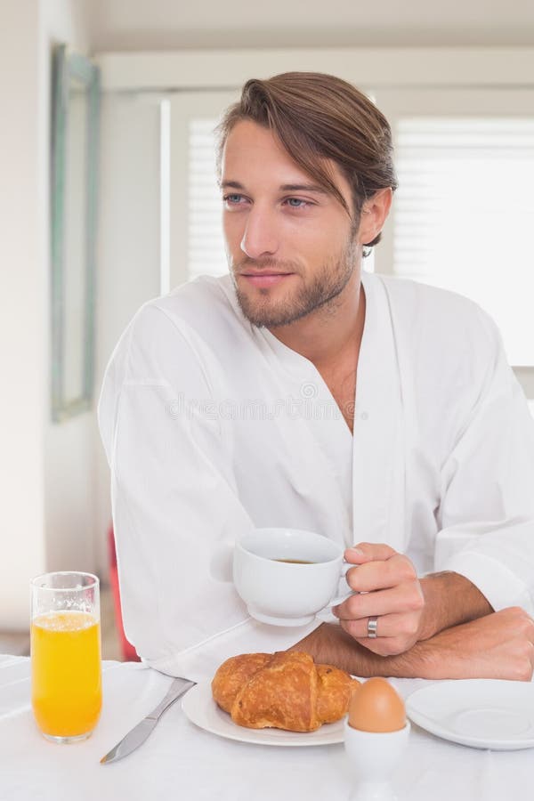 Handsome Man Having Breakfast in His Bathrobe Drinking Coffee Stock ...